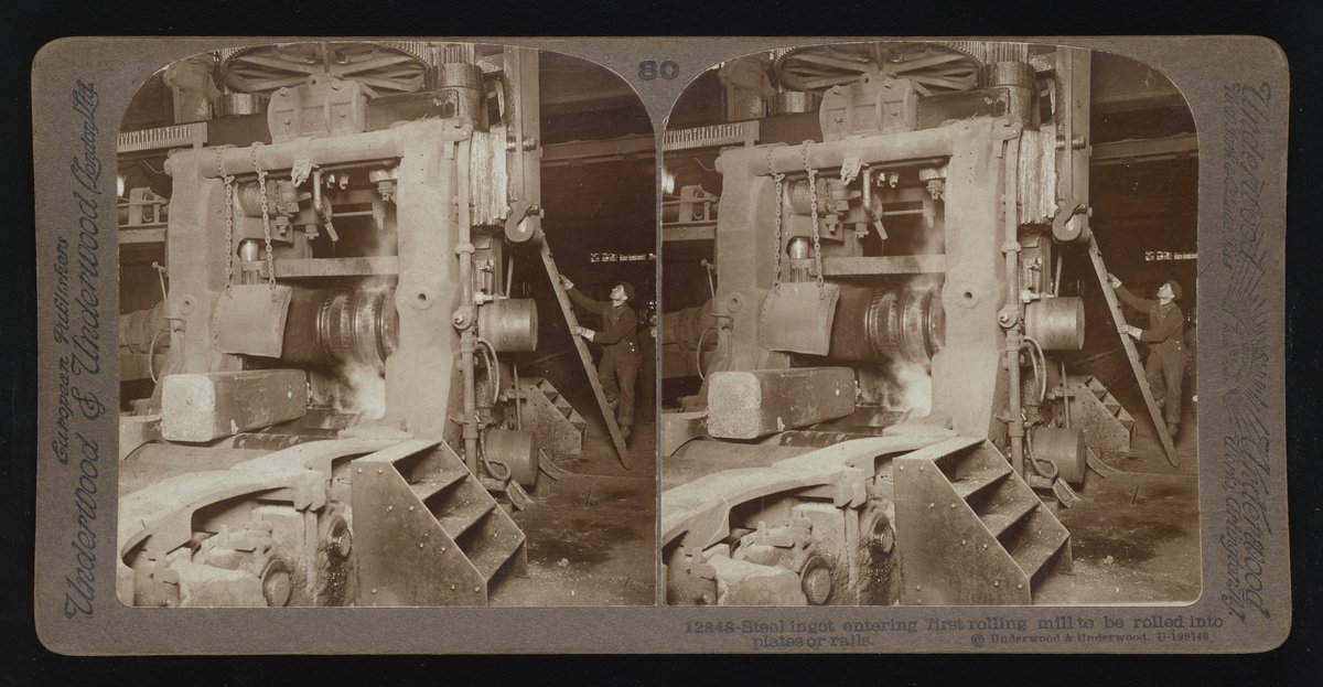 Steel ingot entering first rolling mill to be rolled into plates or ...