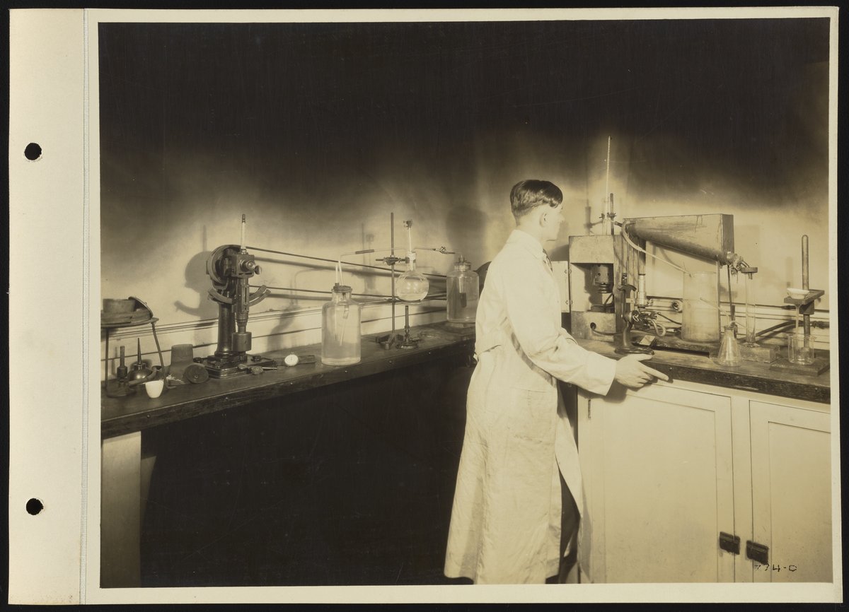 Employee using titration apparatus at Dearborn laboratory facility ...