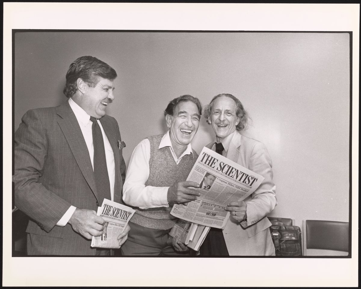 Roland Holub, Stanley Cohen, and Eugene Garfield holding the first ...