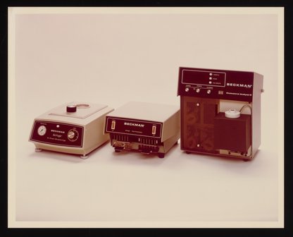 Woman injecting a sample into a Beckman Model E Centrifuge component ...