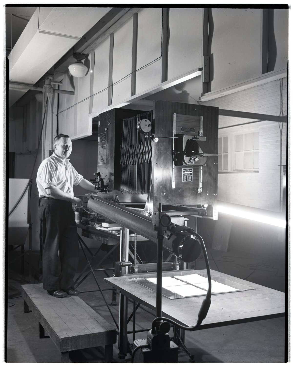 Russ Johnson operating photostat machine in Dow Photographic Laboratory ...