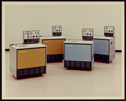 Woman injecting a sample into a Beckman Model E Centrifuge component ...