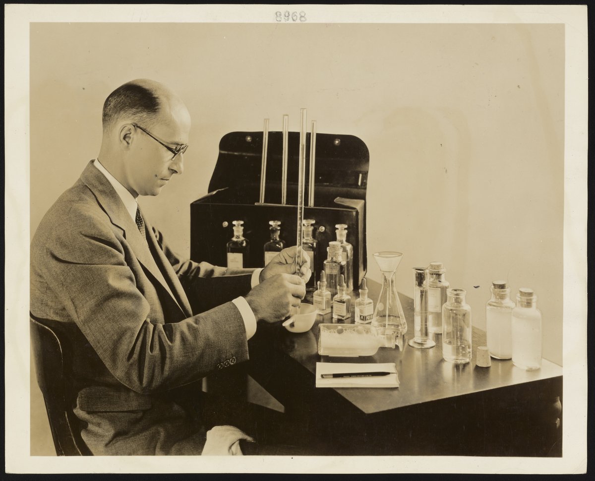 E.P. Fager conducting Dearborn Chemical Company water sample test ...