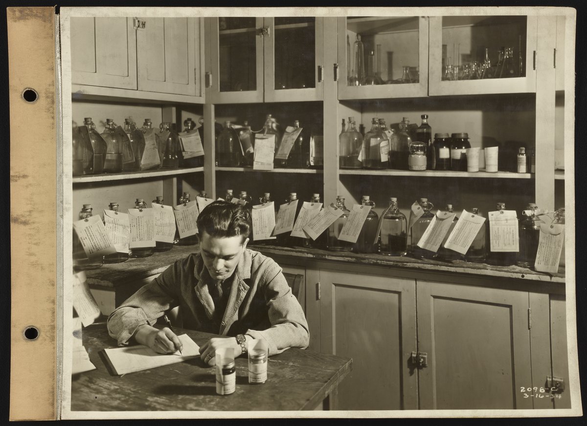 E.L. Konigsmark recording water samples at Dearborn laboratory facility ...