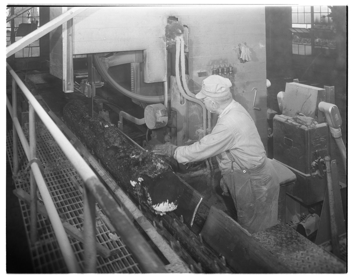 Employee using band saw at Cliffs Dow plant - Science History Institute ...