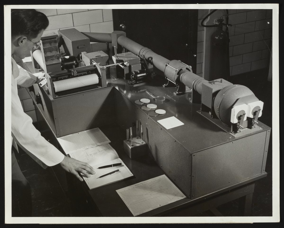 Employees working with General Electric Recording Spectrophotometer ...